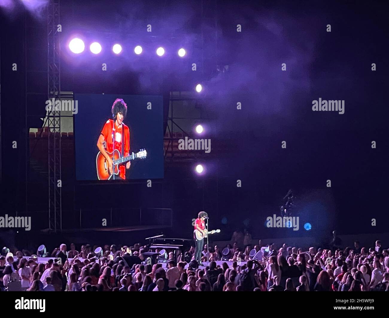 Crowd at concert and blurred stage lights Stock Photo - Alamy