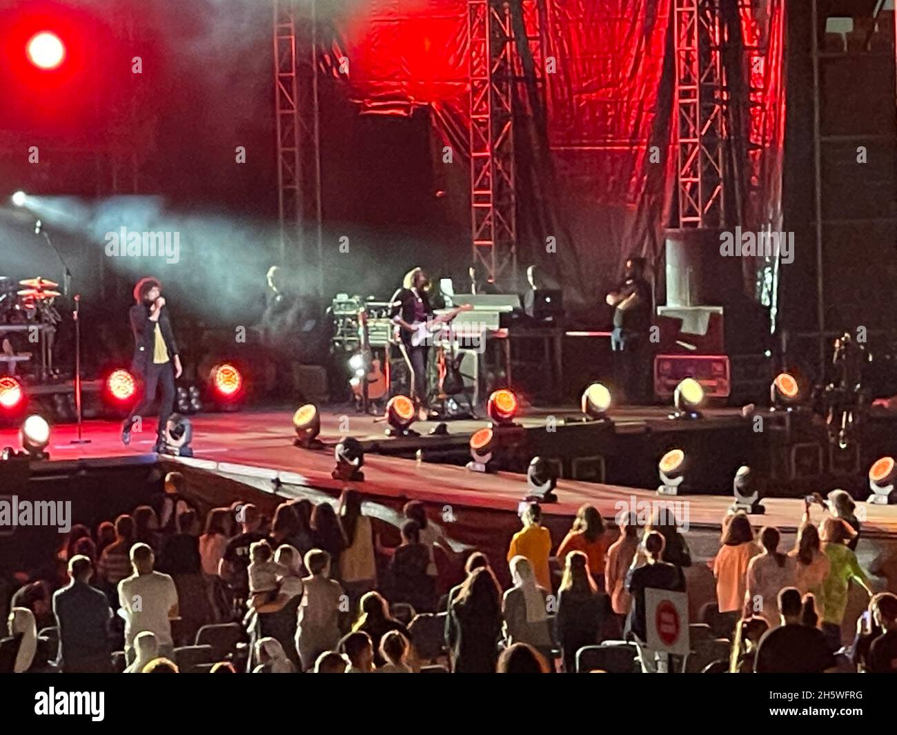 Crowd at concert and blurred stage lights Stock Photo - Alamy