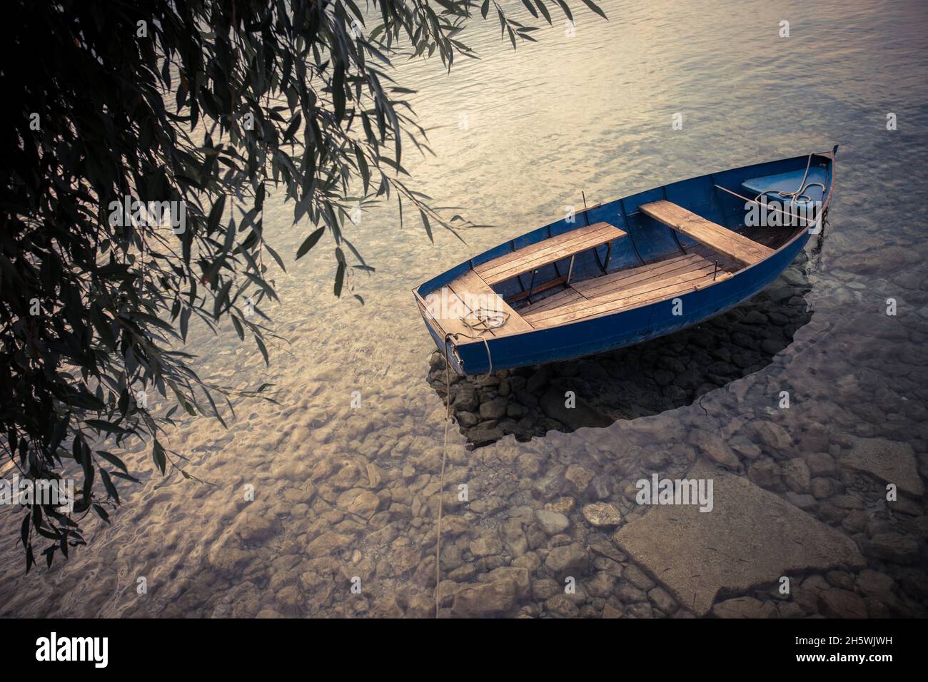 High angle image of a empty wooden boat floating on water Stock Photo ...