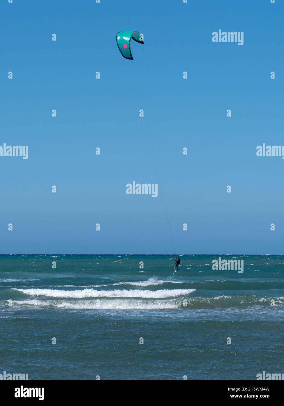Kitesurfing During a Windy Day with a Very Rough Sea Stock Photo - Alamy