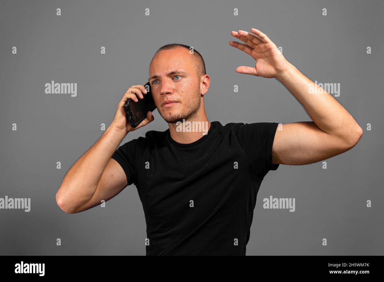 Photo of young caucasian man call talk smartphone angry mad scream ...