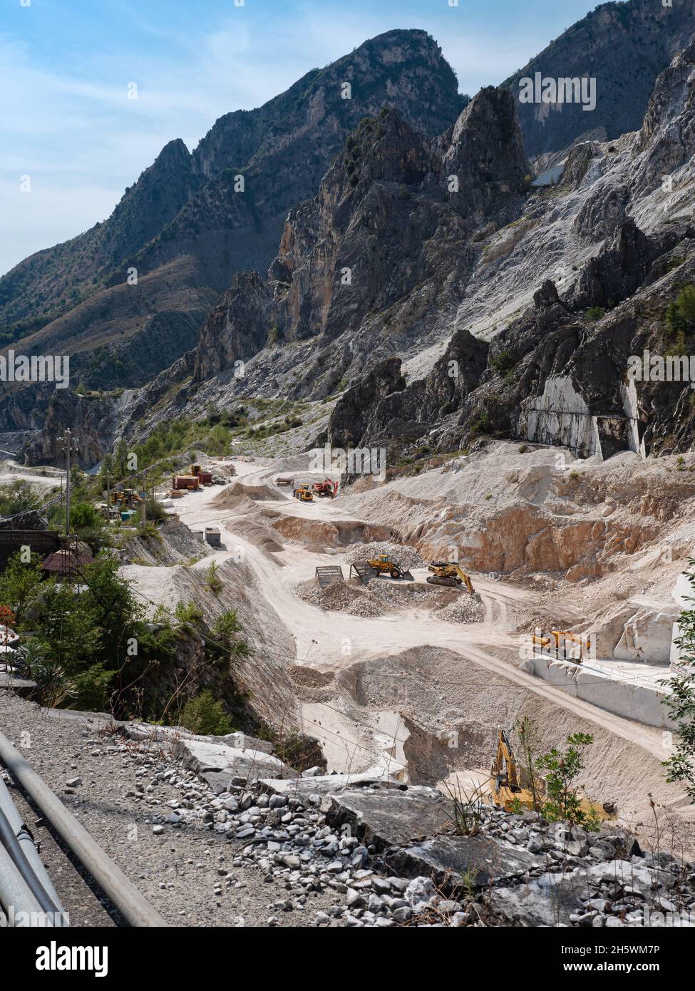View of the Carrara Marble Quarries with Excavation Vehicles ready for ... View of the Carrara Marble Quarries with Excavation Vehicles ready for ...