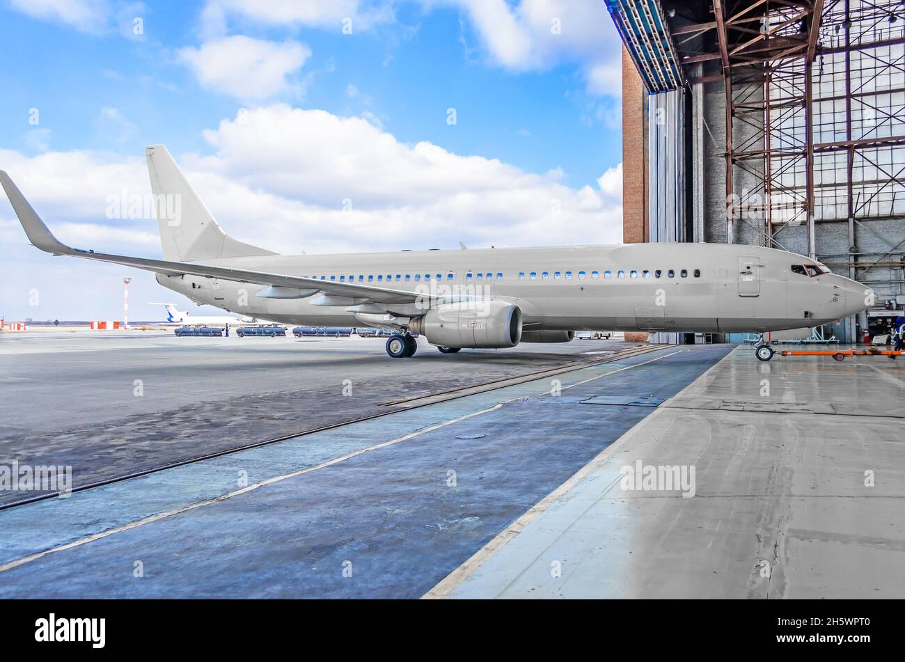 Passenger aircraft on maintenance of engine and fuselage repair in ...