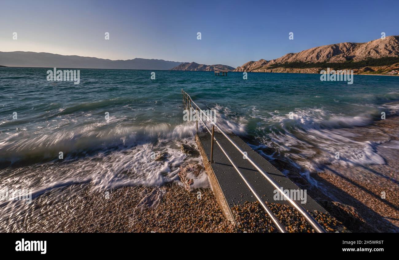 Landscape of the Baska Beach surrounded by cliffs in the Krk Island ...