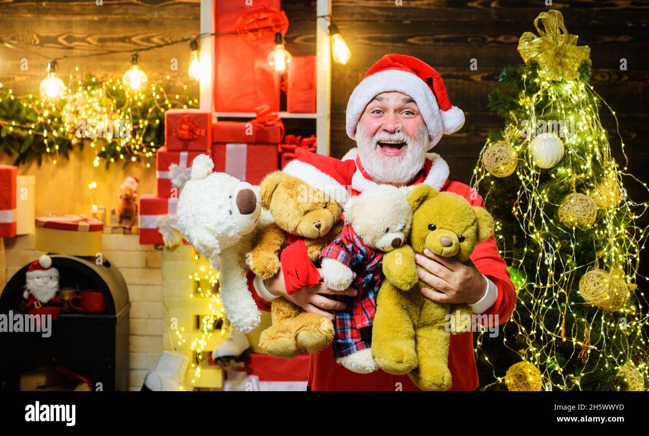 Santa Claus with Teddy bears. Bearded man in santa costume with plush ...