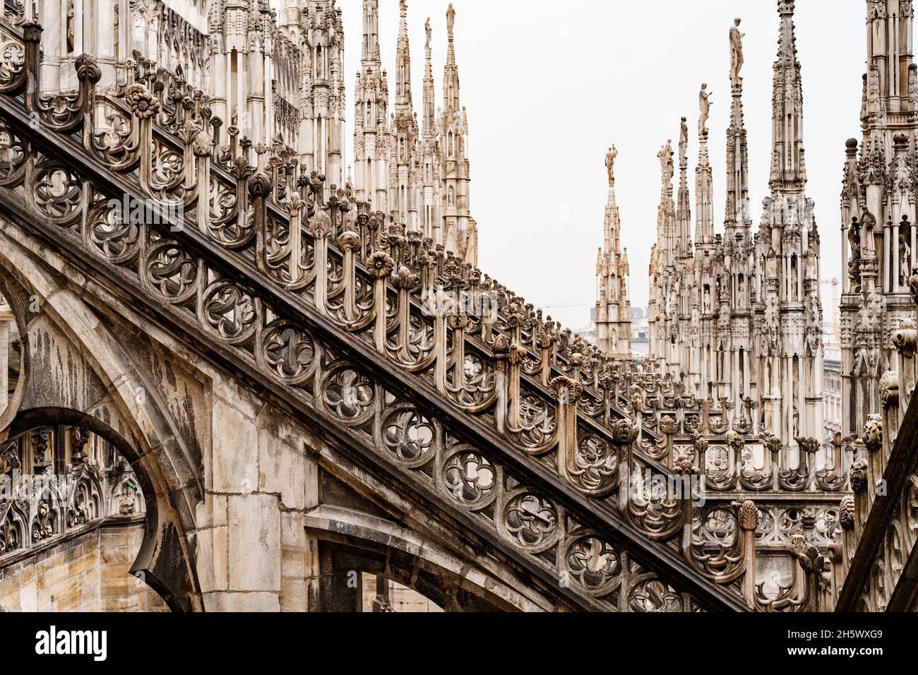 High spires with sculptures of the Duomo. Milan, Italy Stock Photo - Alamy