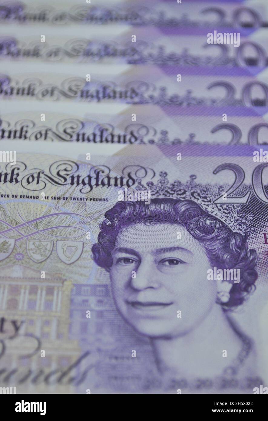 Multiple £20 Bank of England notes arranged showing the Queen's head in ...