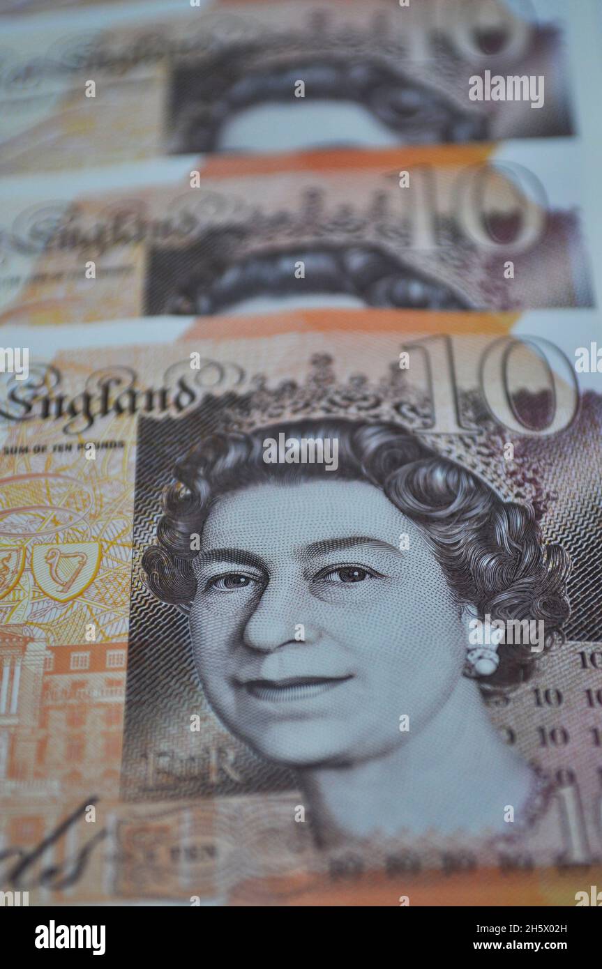 Multiple £10 Bank of England notes arranged with the Queen's head in ...