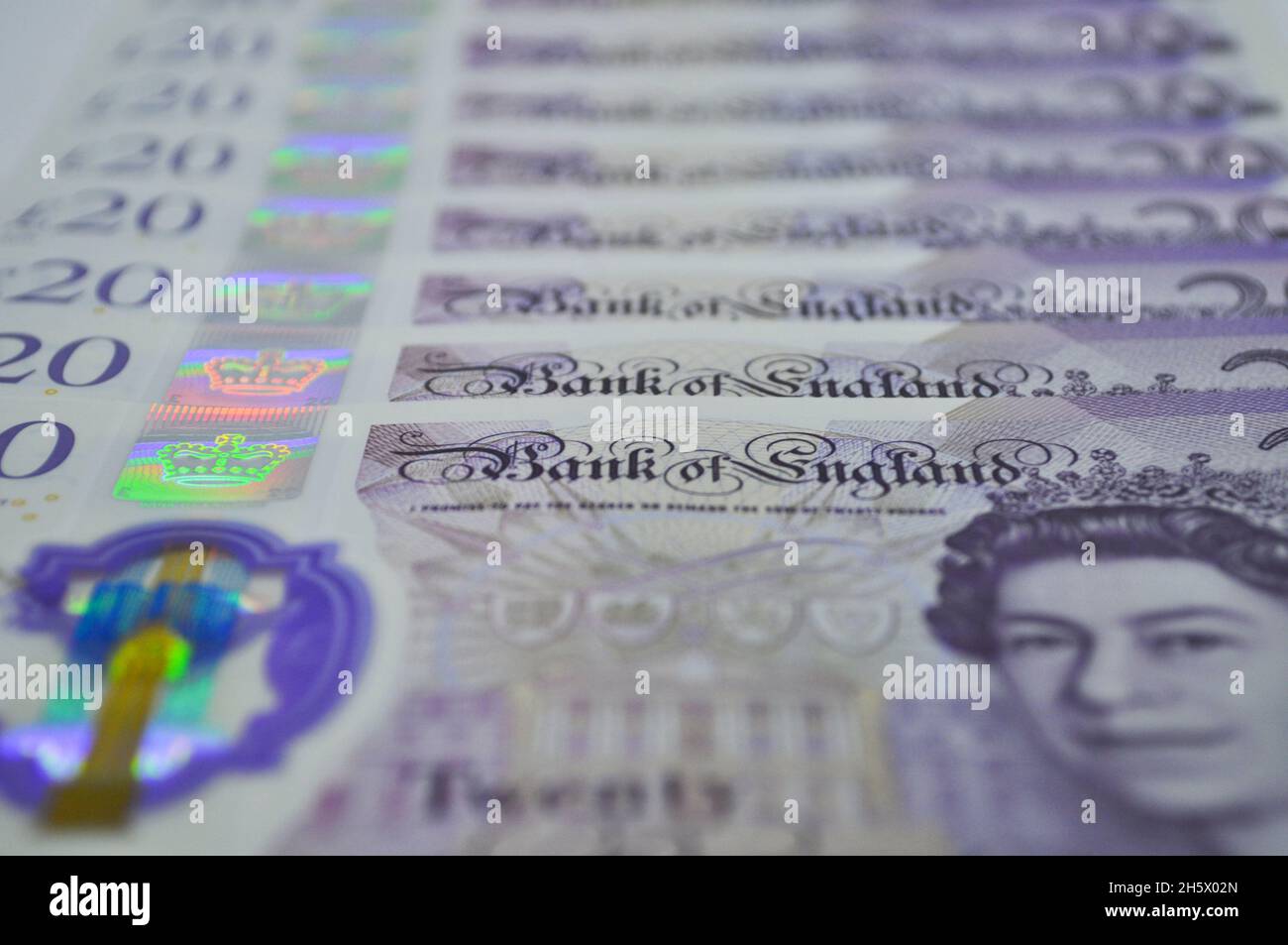 Multiple £20 Bank of England notes arranged showing the Queen's head in ...