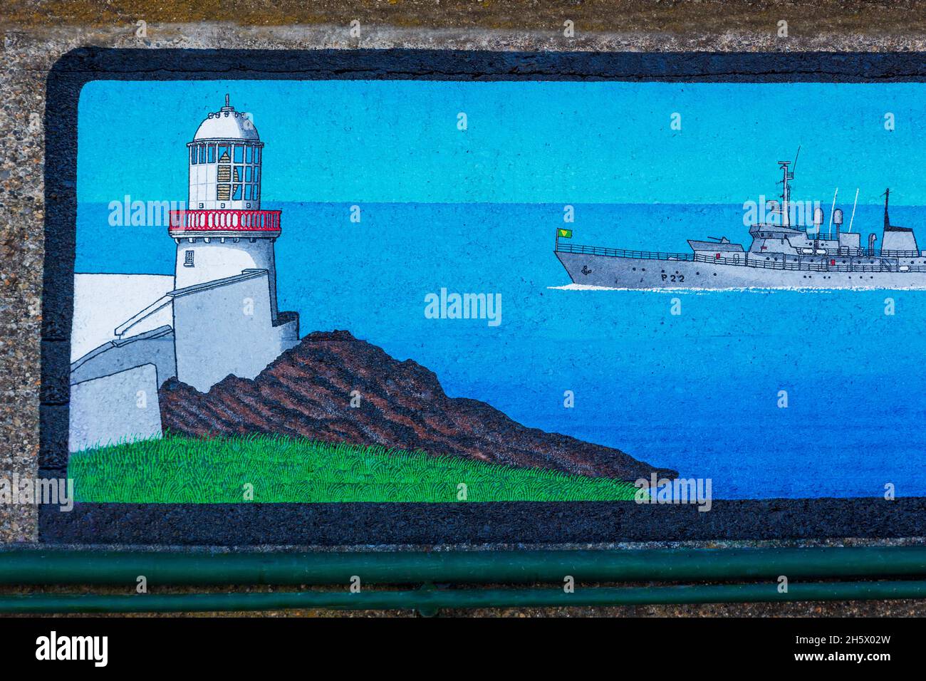 Wicklow Head Lighthouse painted on pier, Wicklow Harbour, County ...