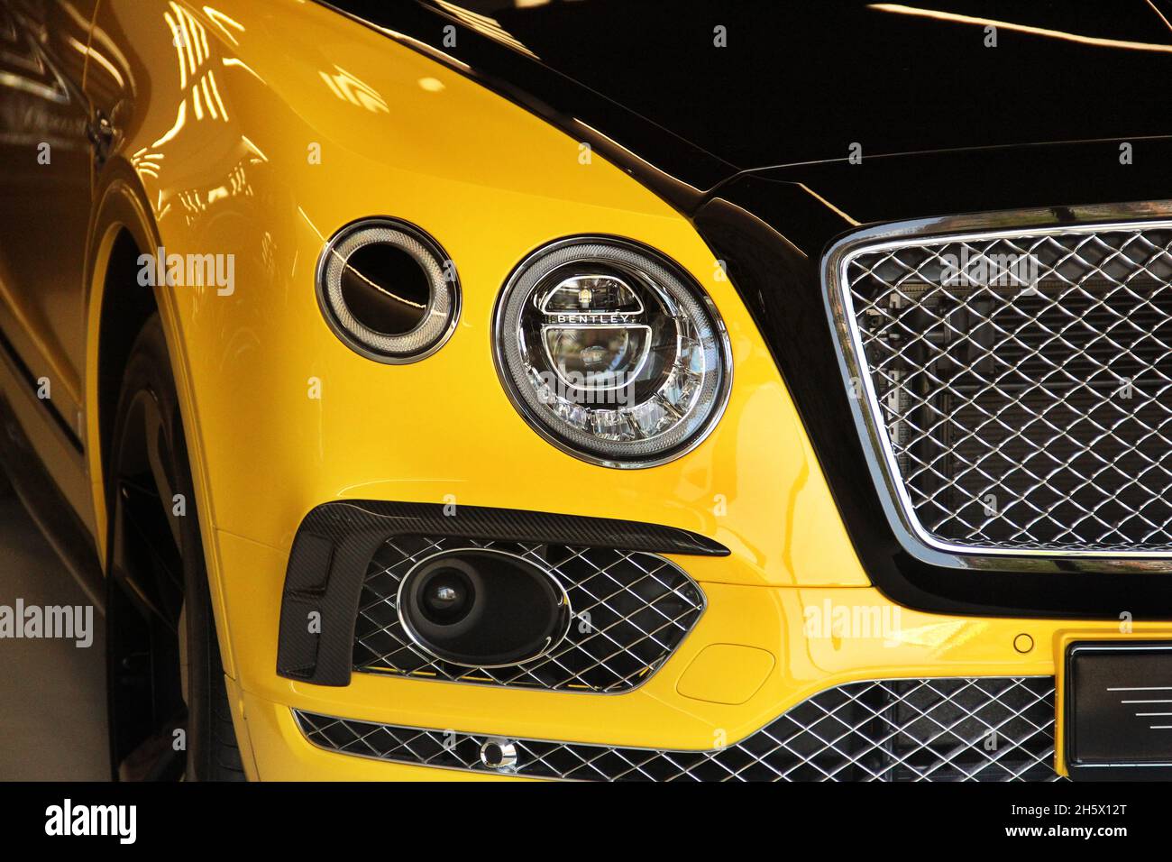 Kiev, Ukraine - May 3, 2019: Yellow Bentley Bentayga Mansory in the ...