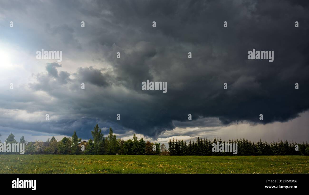Angry Storm Clouds at summer in the meadow Stock Photo - Alamy