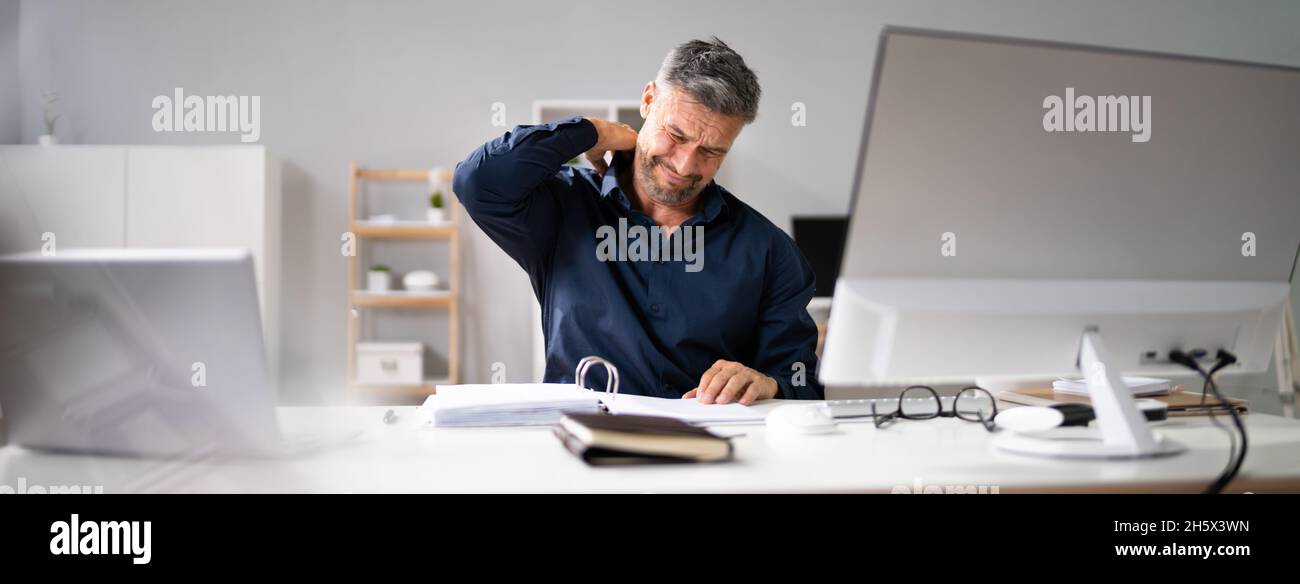 Neck Pain And Stress. Bad Posture At Computer In Office Stock Photo - Alamy
