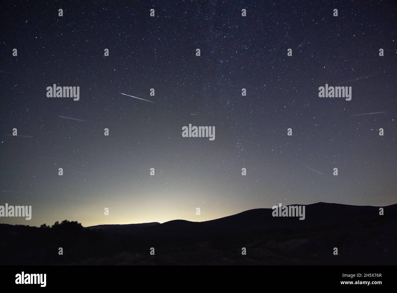 A view of a meter shower called Perseid with the milky way behind Stock ...