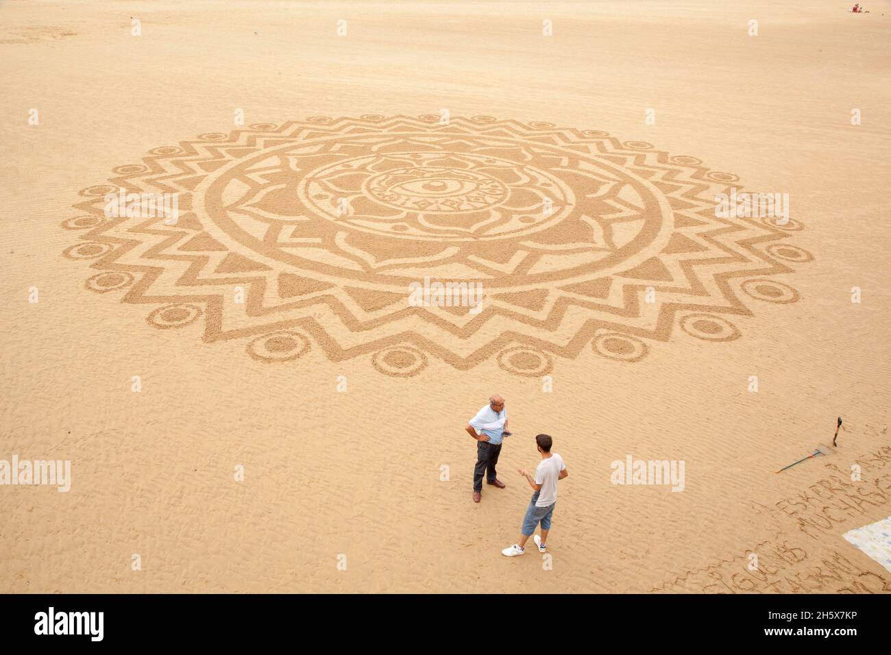 Sand artwork on the beach at the Spanish seaside resort of San ...