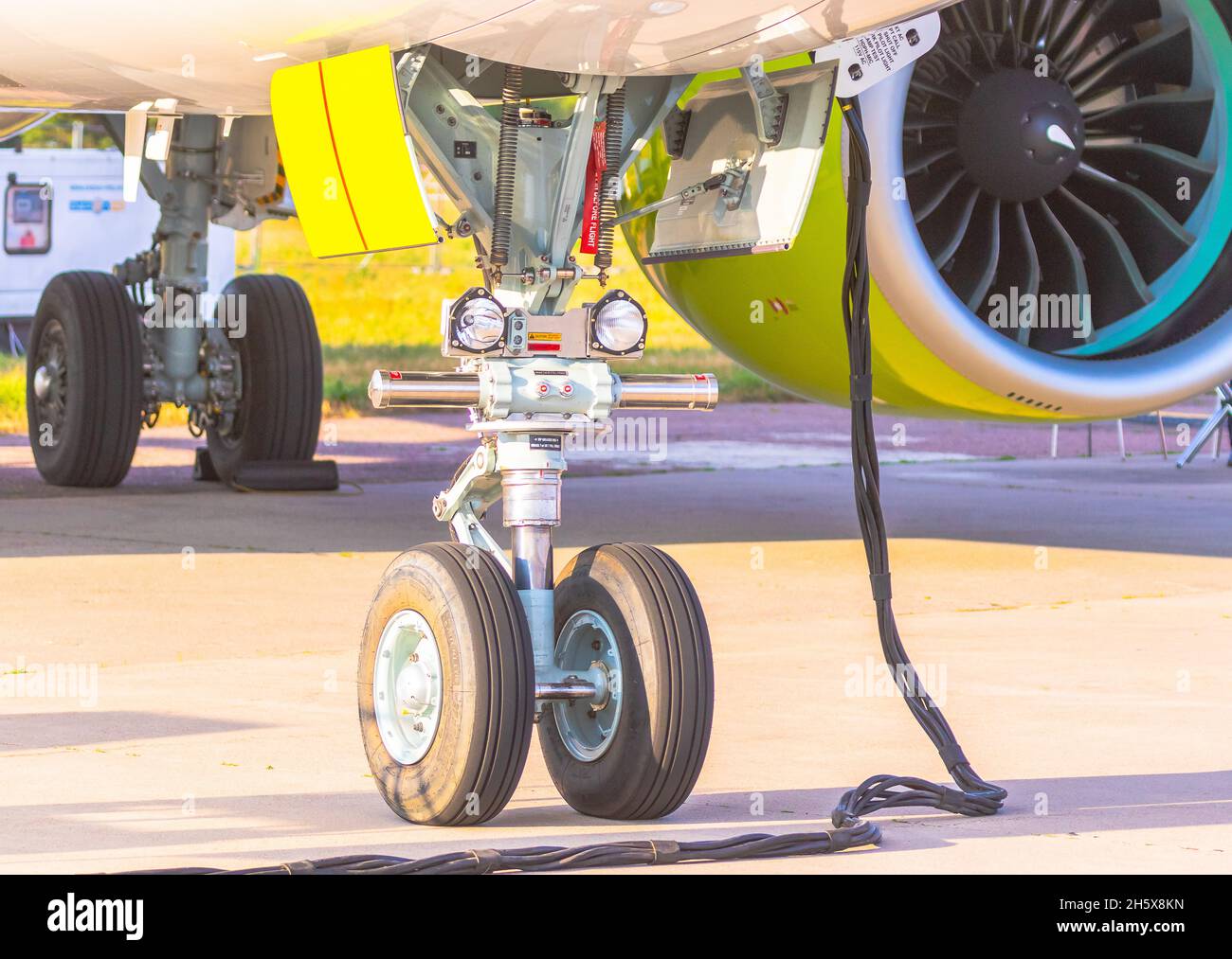 the jet is on ground service at the airport, the landing gear and the ...