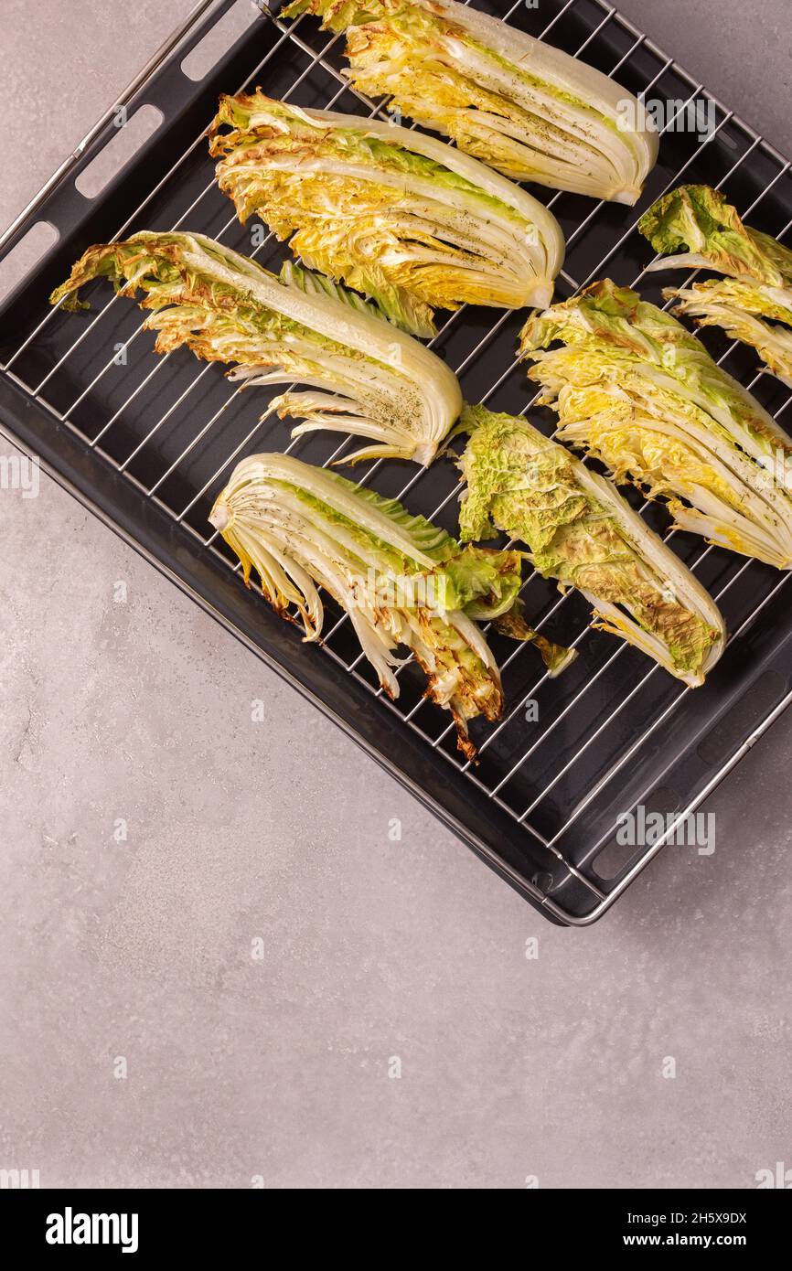 Chopped baked Chinese cabbage on a baking sheet, top view Stock Photo ...