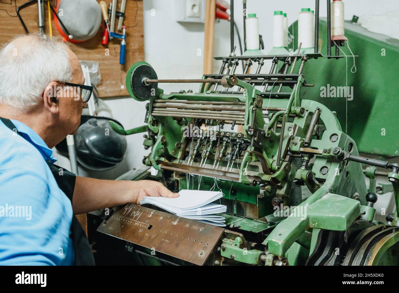 Man putting paper in machine hi-res stock photography and images - Alamy
