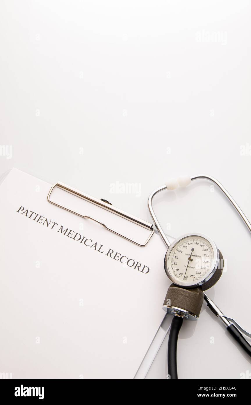 Patient medical record on clipboard with stethoscope. white copy space ...
