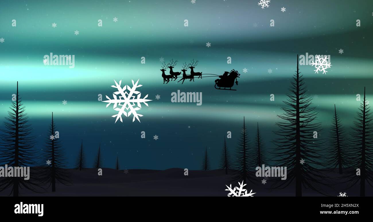 Image of snow falling at christmas over santa in sleigh Stock Photo - Alamy