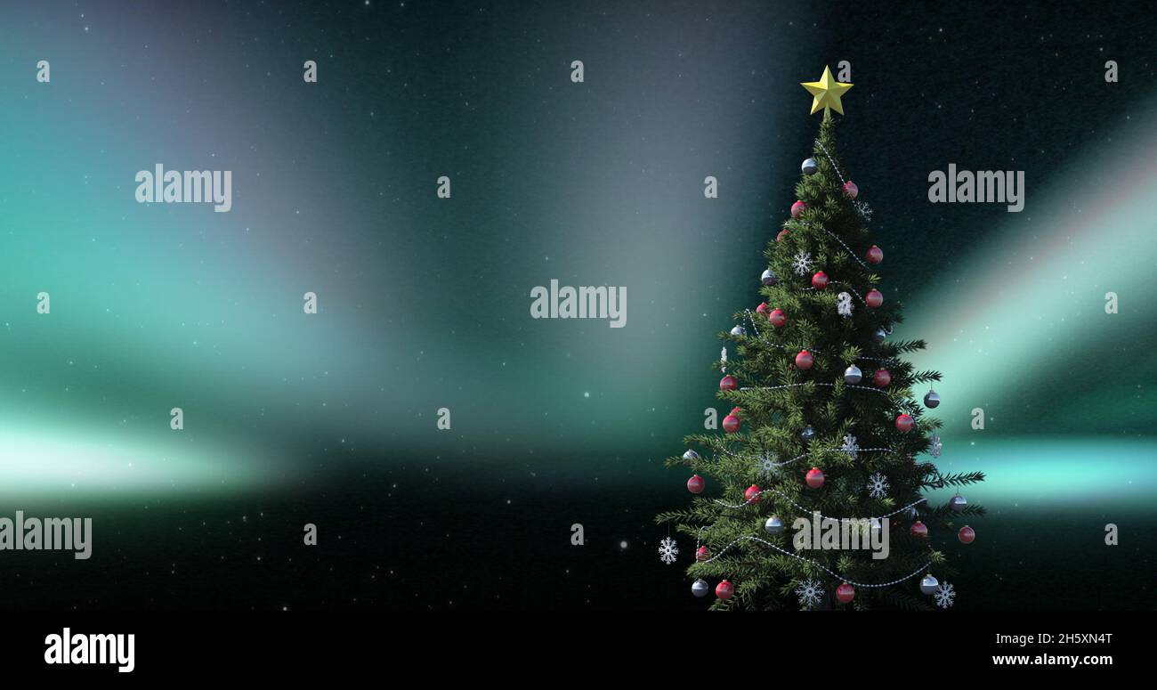 Image of christmas tree over aurora Stock Photo - Alamy