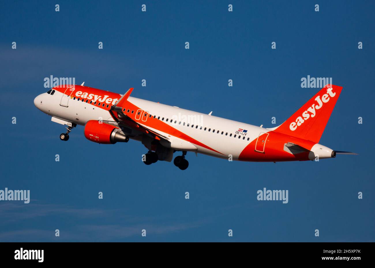 Passenger aircraft of EasyJet airlines taking off from airport Stock ...