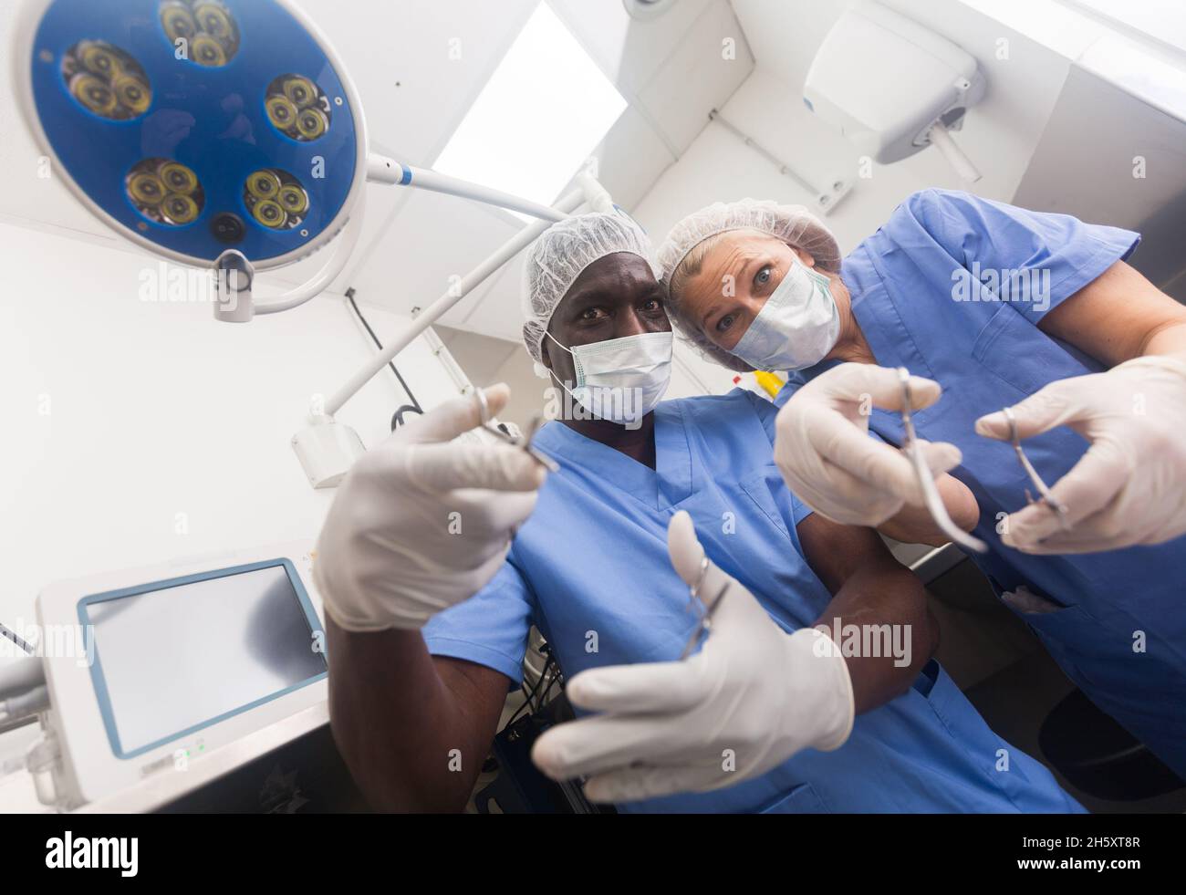 Patient from the operating table view of the surgical and assistant ...