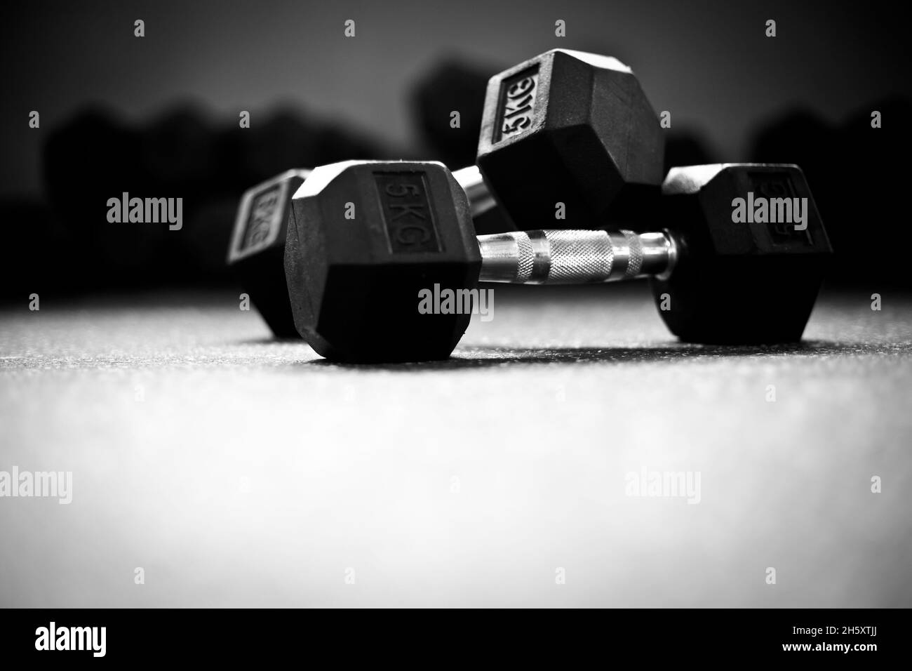 Dumbbell weights on dumbells rack hi-res stock photography and images ...