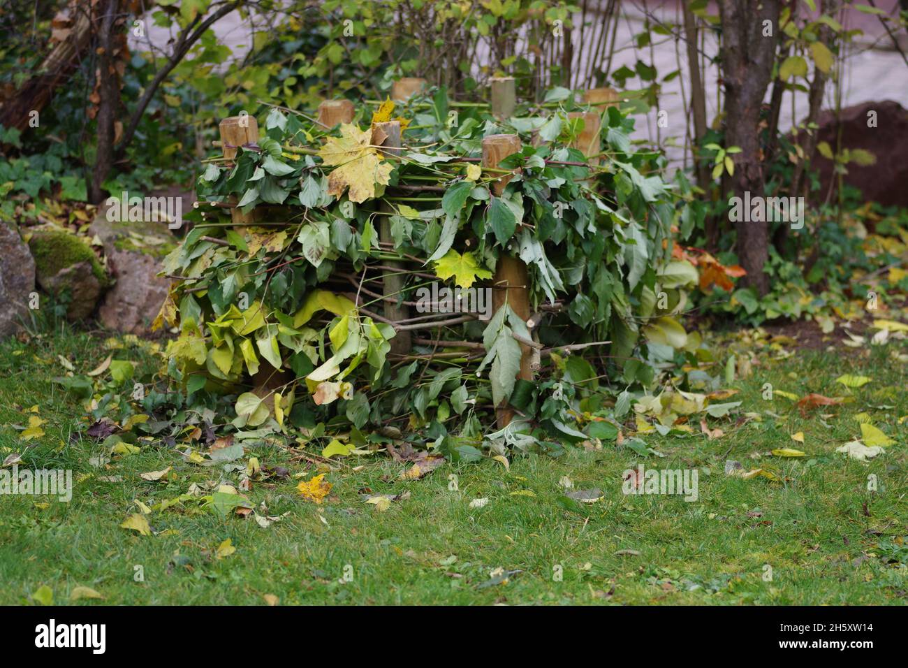 A winter burrow for hedgehogs, birds, mice, insects, etc Stock Photo ...