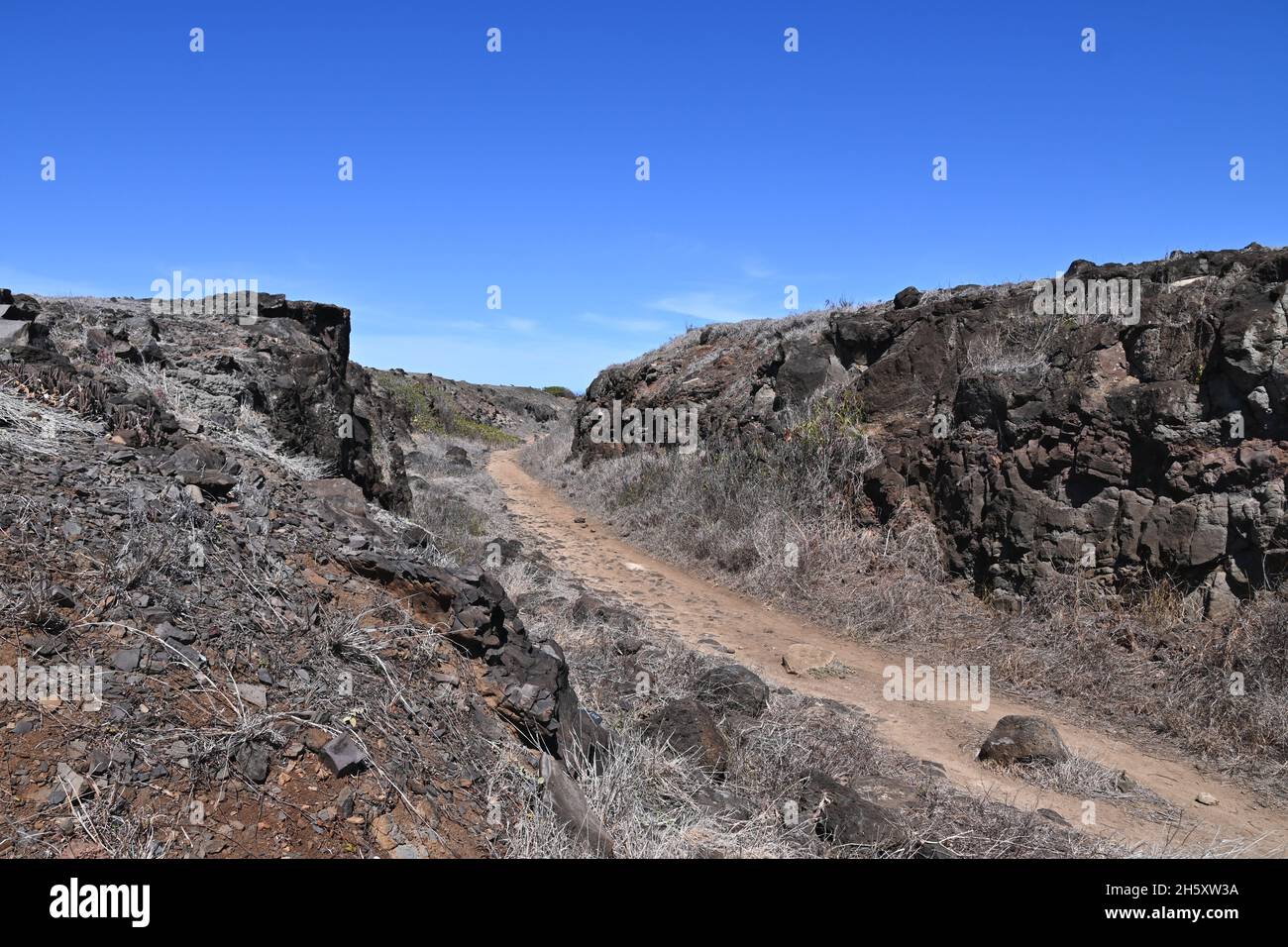 Path through volcanic rock formations, Ka’ena Point, Oahu, Hawaii Stock ...