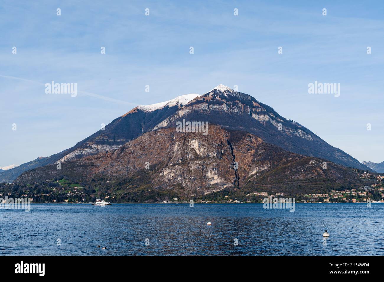 Snow on the mountain peaks near Lake Como. Italy Stock Photo - Alamy