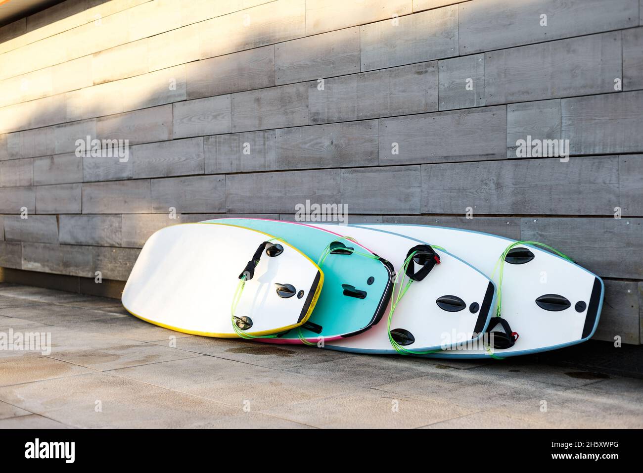 surfboards on the ground at sunset Stock Photo - Alamy