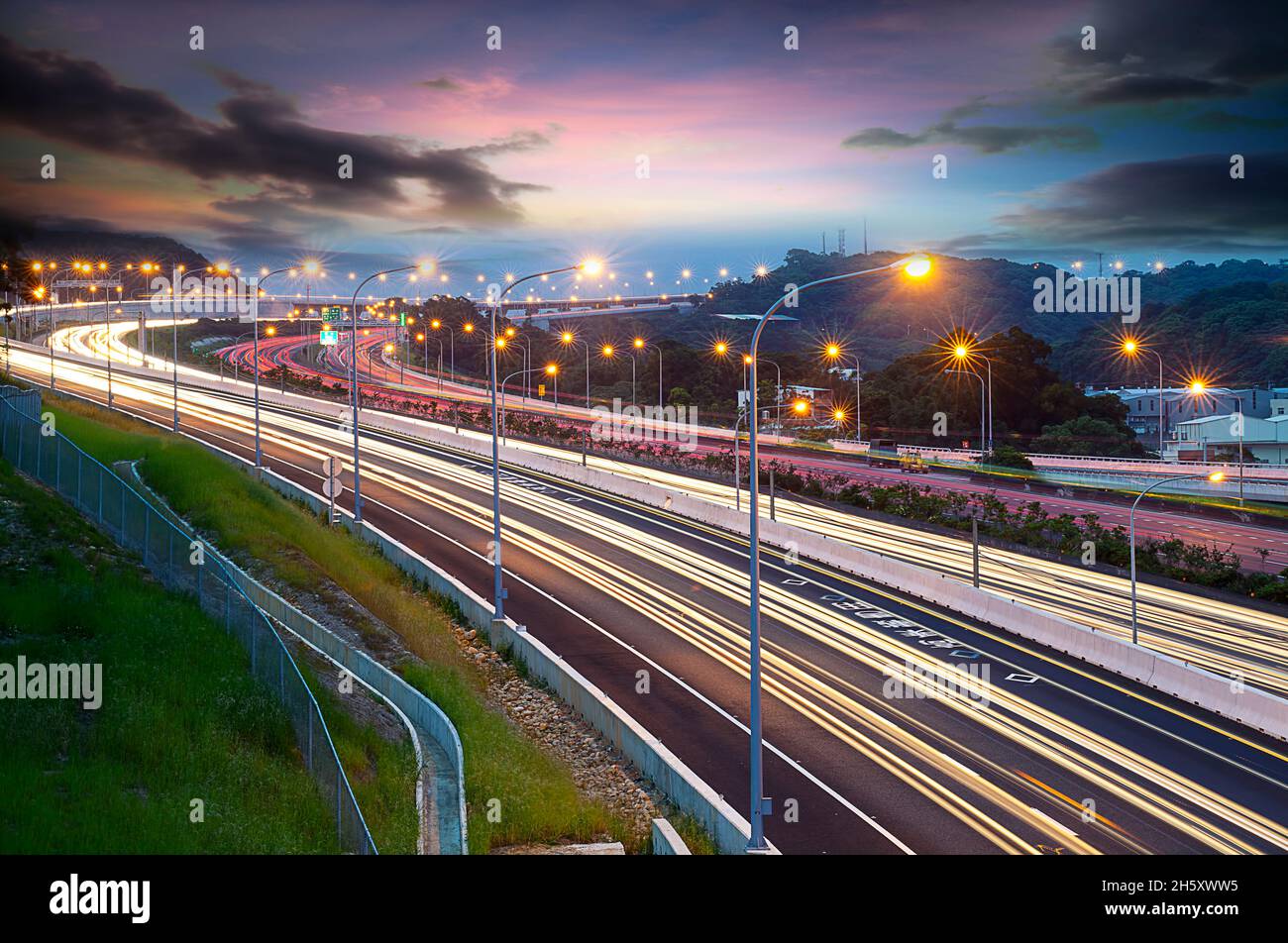 The Light trails on motorway highway at night, long exposure abstract ...