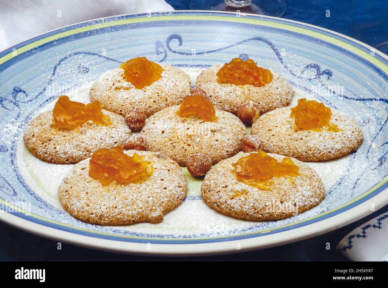 Biscuits with nuts and fruit jam topping Stock Photo - Alamy