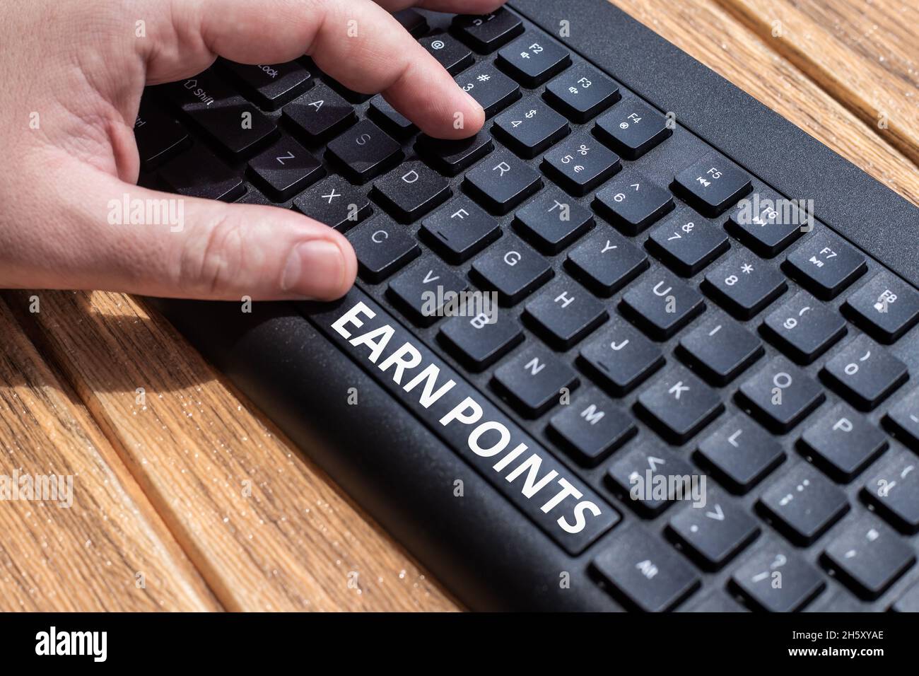 Handwriting text Earn Points. Word Written on collecting scores in ...