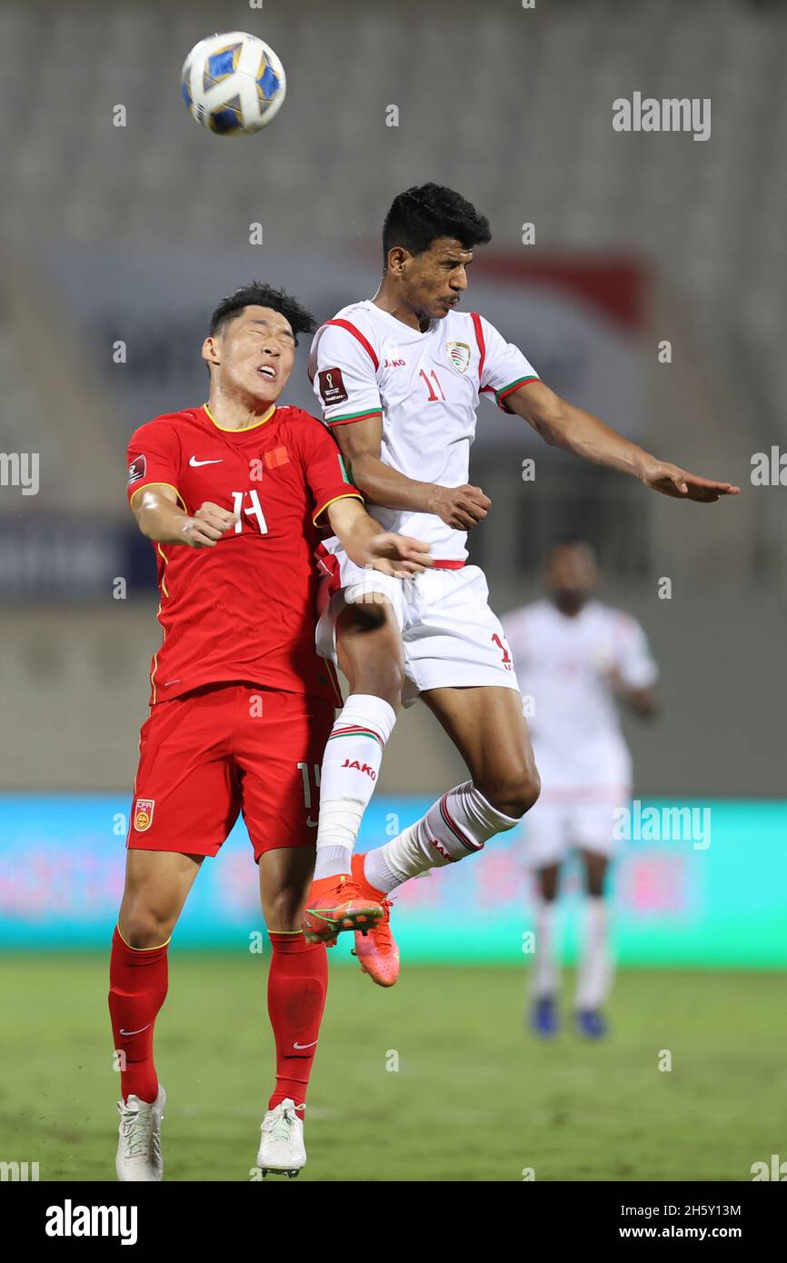 Sharjah, UAE. 12th Nov, 2021. Zhu Chenjie (L) of China vies for a ...