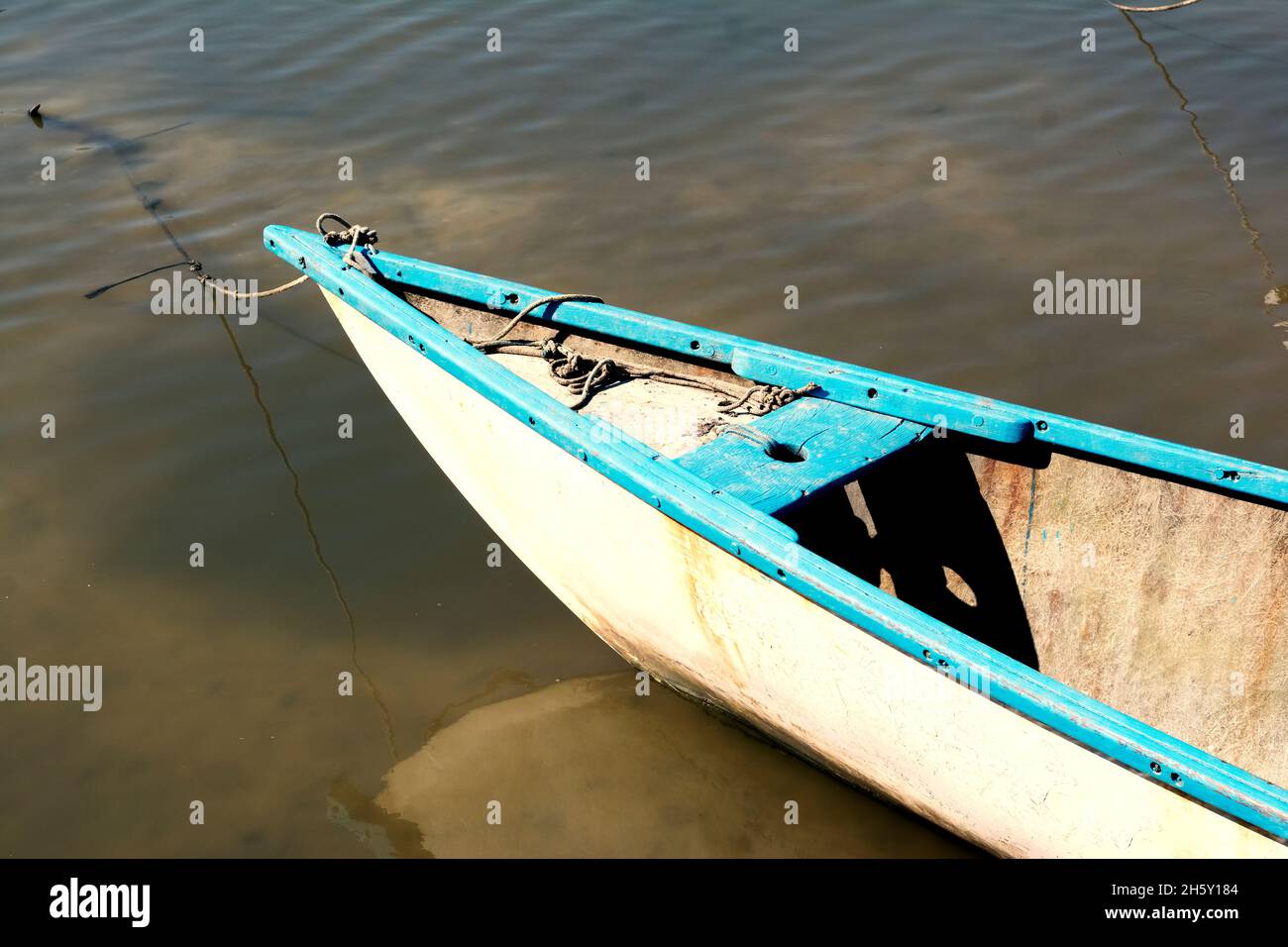 Canoes and colorful boats docked on the Paraguacu River in Saubara in ...