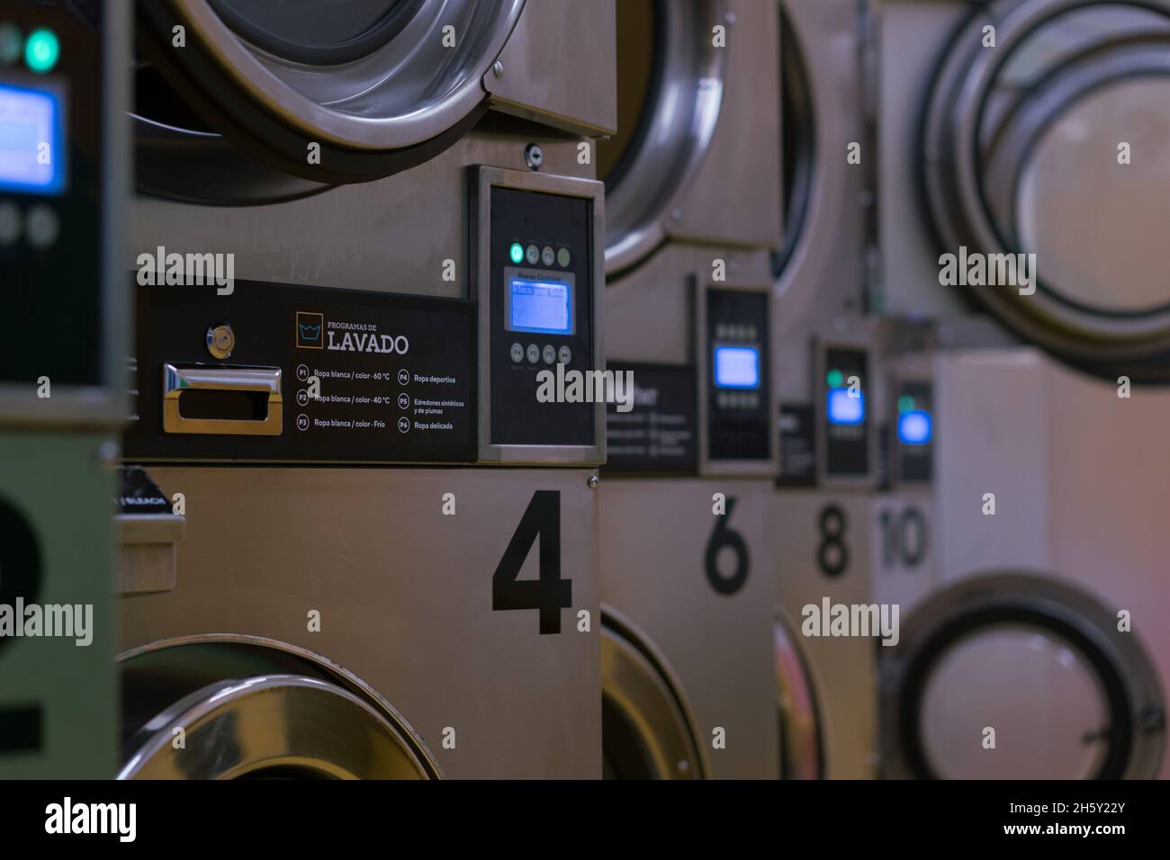 BARCELONA, SPAIN - Nov 09, 2021: Row of industrial washing machines in ...