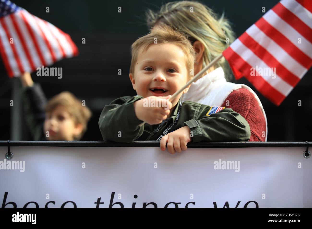 New York, N.Y/USA – 11th Nov. 2021: A child waves a flag of the United ...