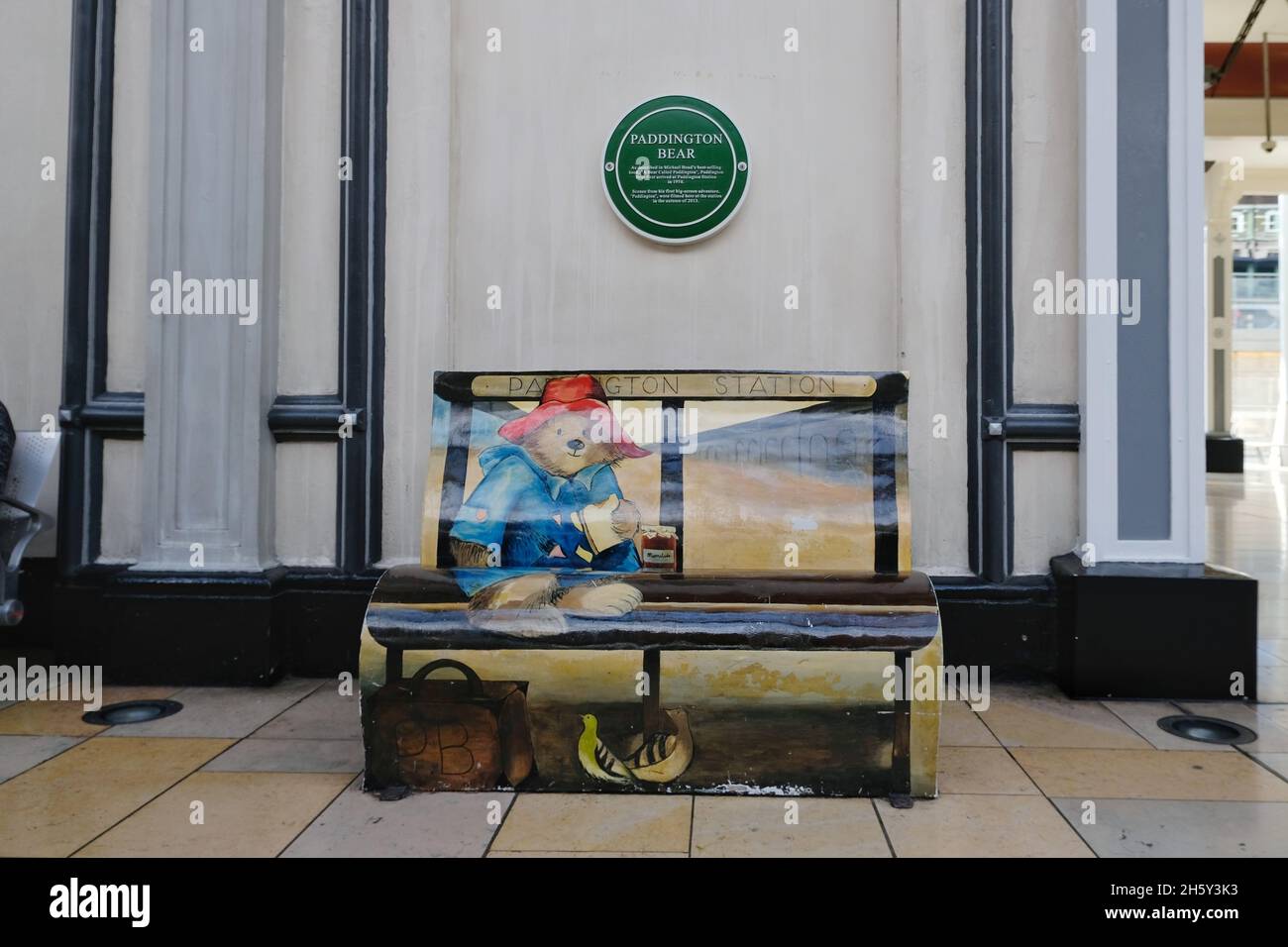 The Paddington Bear bench at London's Paddington Station and a roundel ...