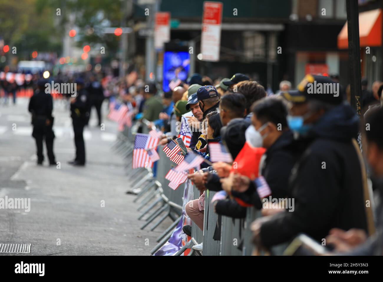 New York, N.Y/USA – 11th Nov. 2021: Spectators wave flags as vets march ...