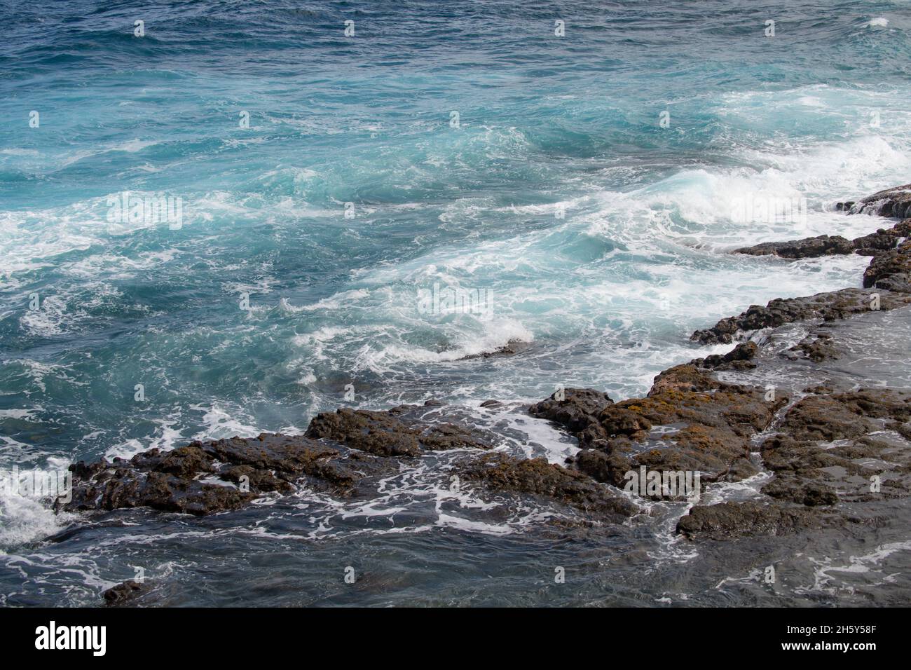 Splashing waves on the rock in the sea. Wave hit the stone in the ocean ...