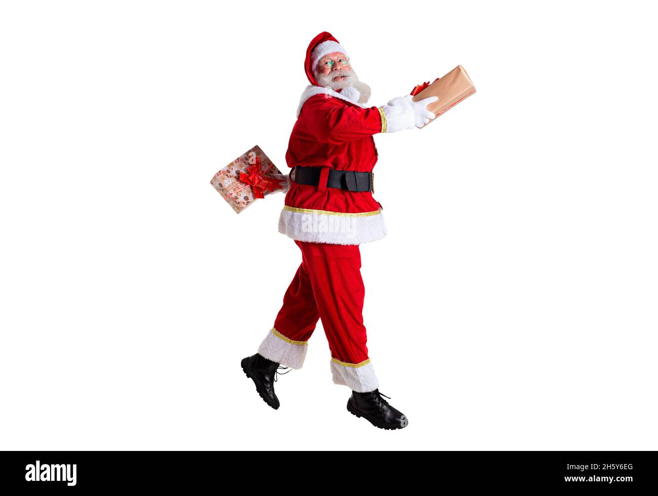 Santa Claus running on white background Stock Photo - Alamy
