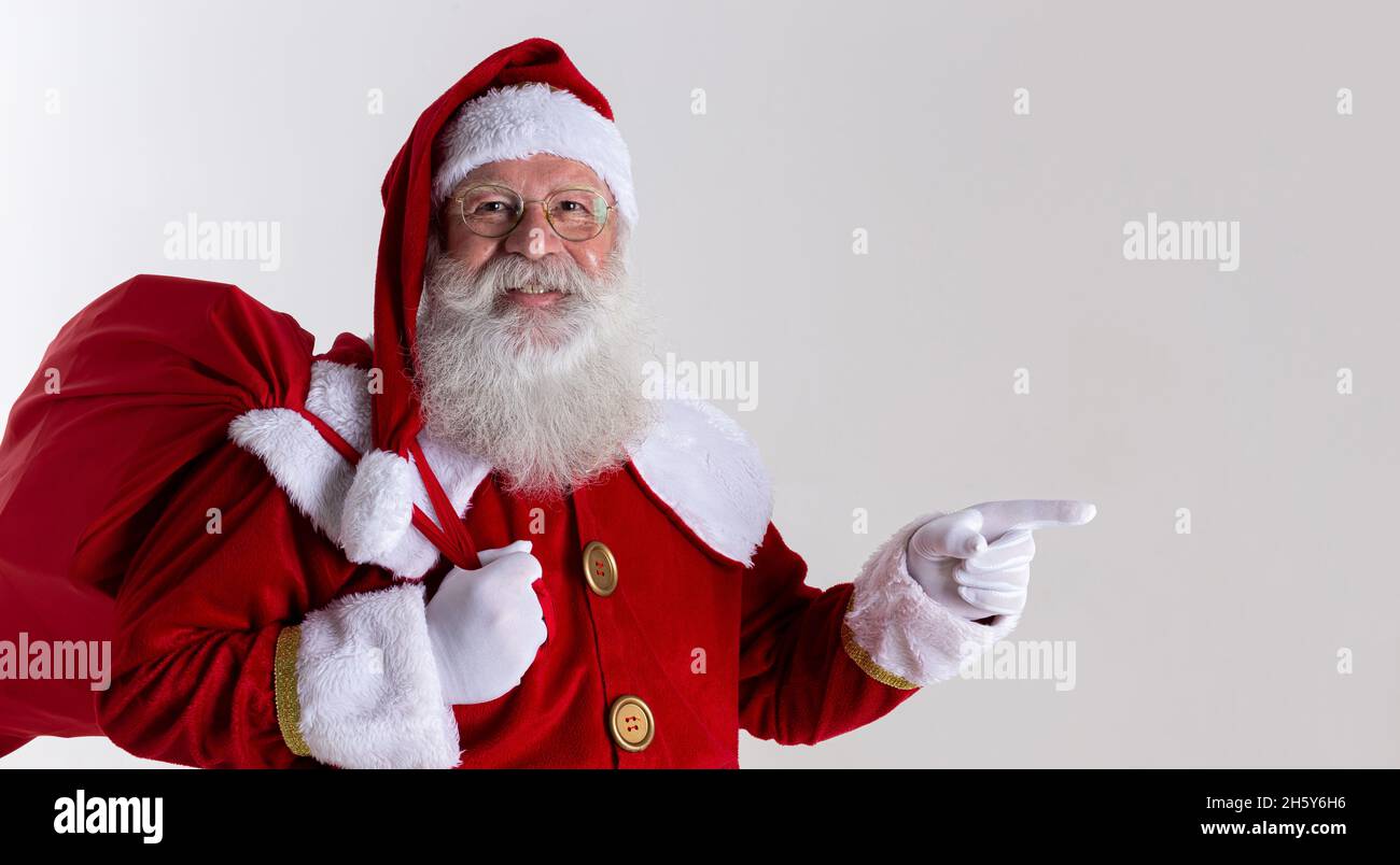 Photo of Santa Claus gloved hand in pointing gesture. Santa Claus ...