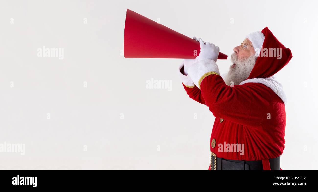 Santa Claus shouting using megaphone over white background Stock Photo ...
