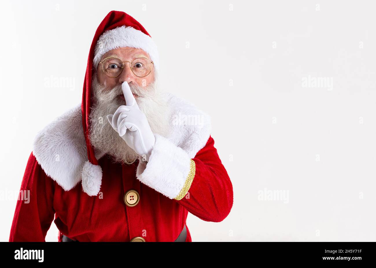 Santa Claus keeping forefinger by his mouth. Shh! Keep secret. Silent ...