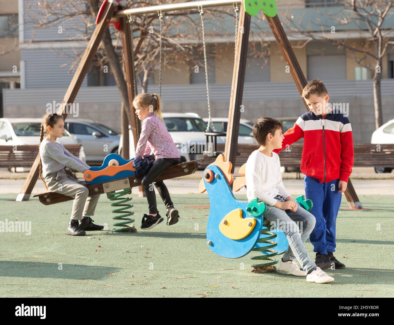 Children playing on playground Stock Photo - Alamy