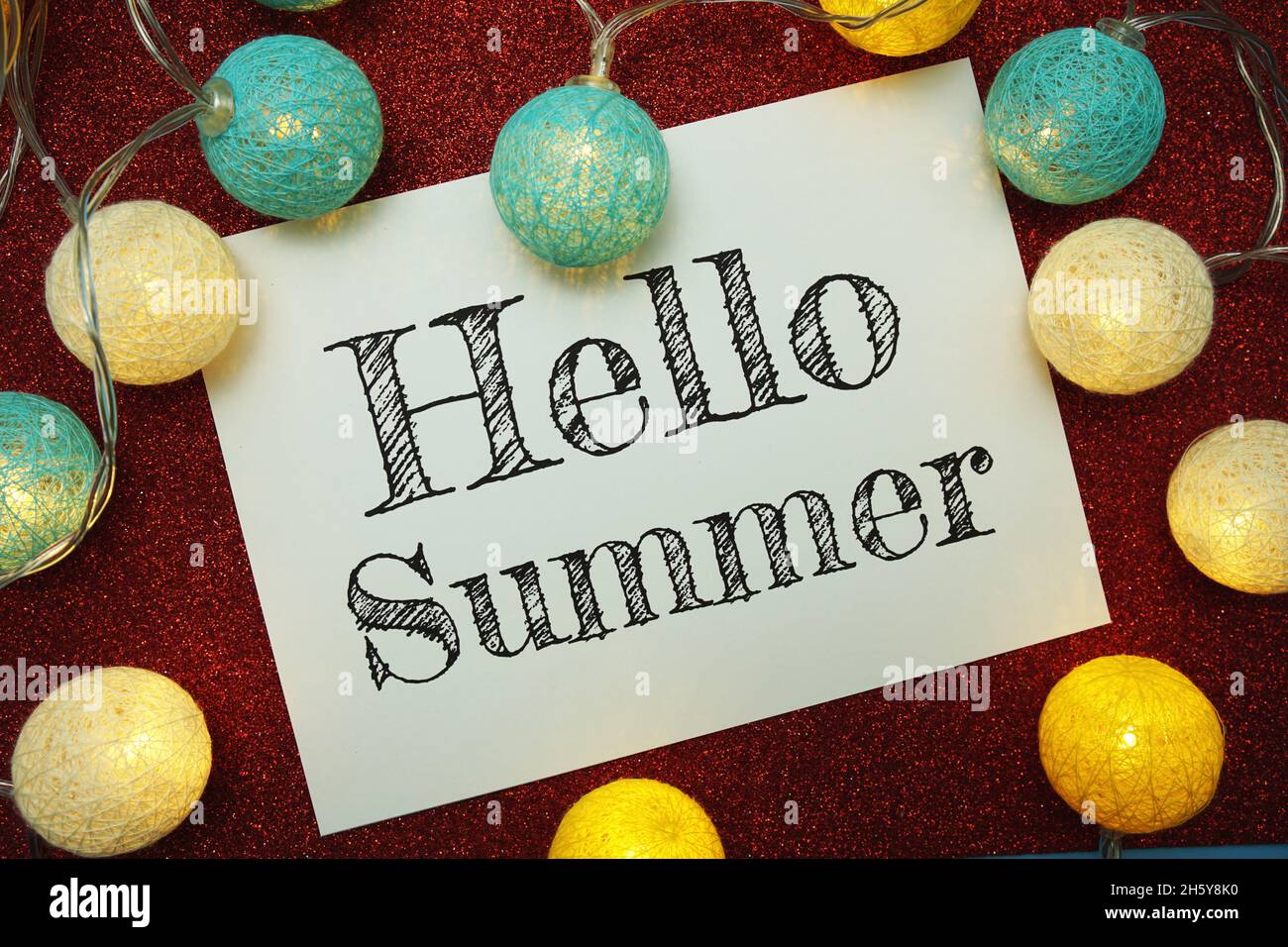 Hello Summer typography text with LED cotton ball on red glitter ...