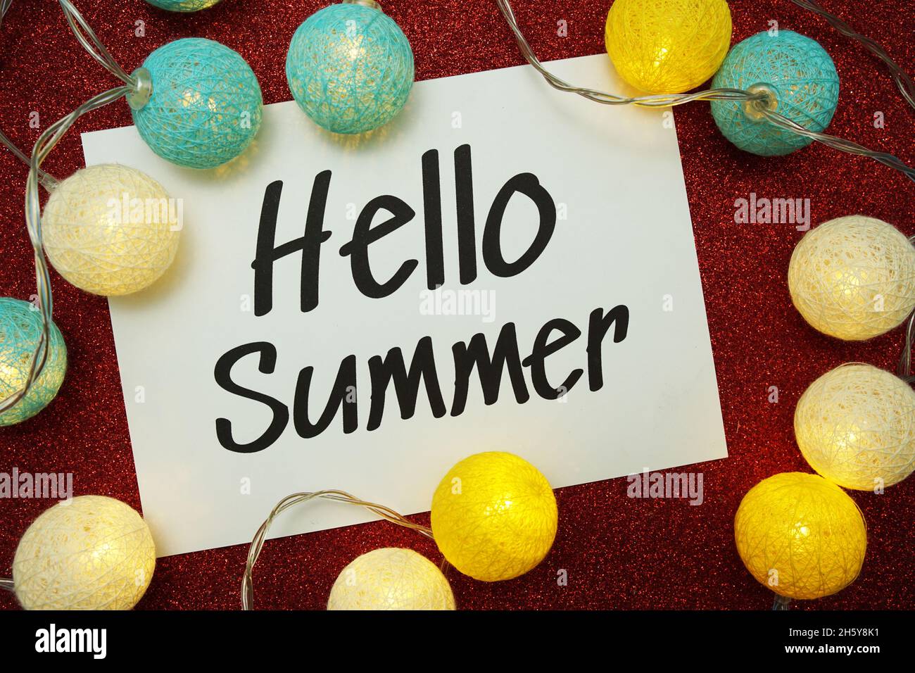 Hello Summer typography text with LED cotton ball on red glitter ...