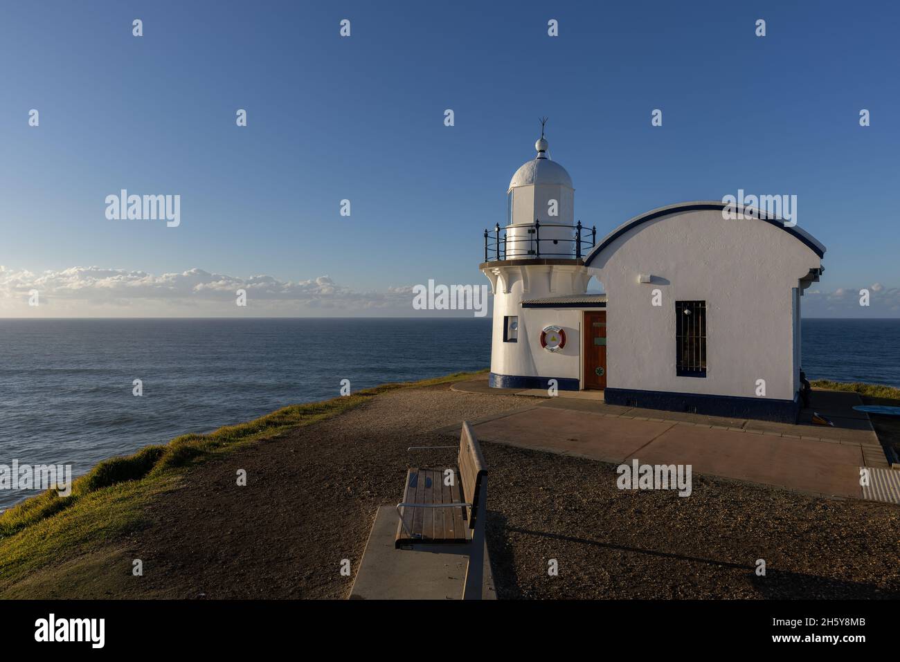 tacking point lighthouse and bench on an autumn morning at port ...
